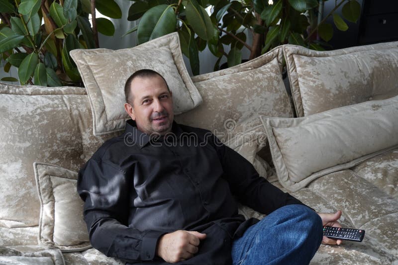 Man Sitting on Sofa and Watching Tv Stock Image - Image of leisure ...