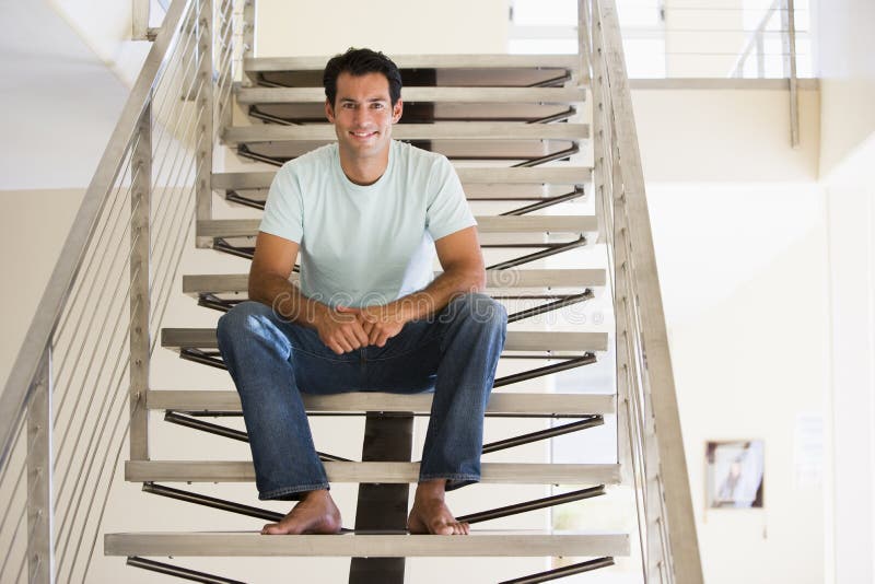 Man Sitting on Staircase Smiling Stock Photo - Image of caucasian ...