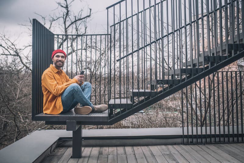 Man Sitting on the Steps of the City Bridge Stock Image - Image of ...