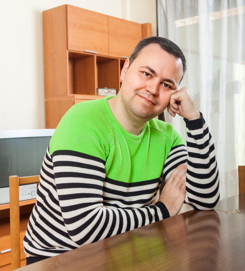 Man sitting at table stock photo. Image of male, relaxed - 44549026