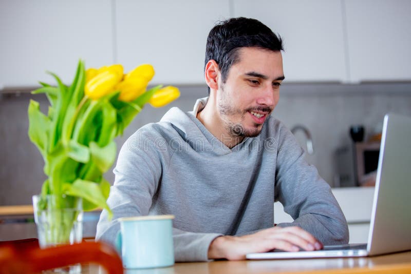 Man Sitting at Table with Cup of Coffee and Laptop Stock Image - Image ...