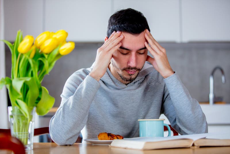 Man Sitting at Table with Cup of Coffee or Tea and Book. Stock Image ...