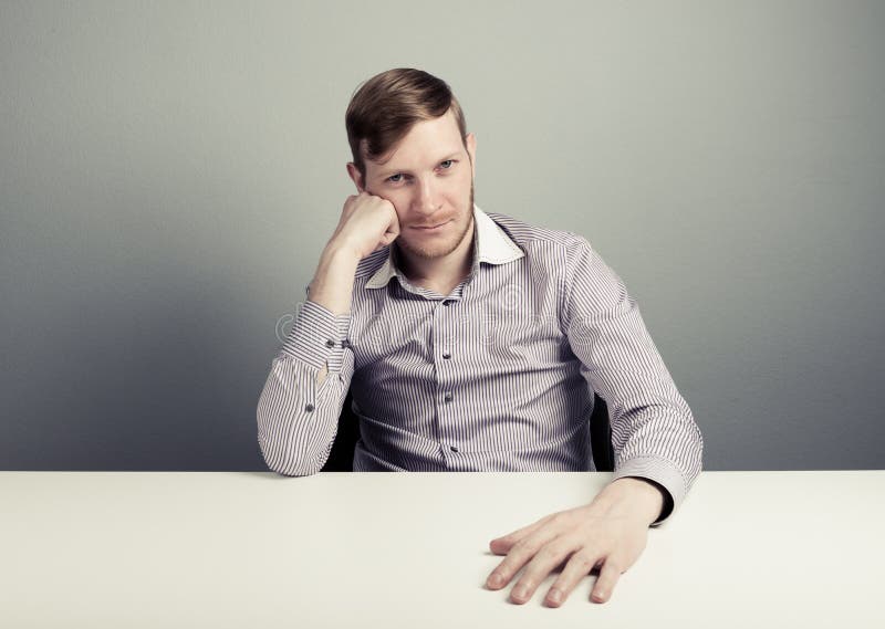 Man sitting at the table stock photo. Image of pensive - 123631734
