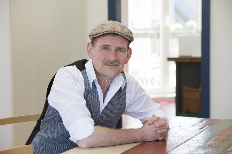 Man sitting at table stock image. Image of flowers, tulips - 54906539