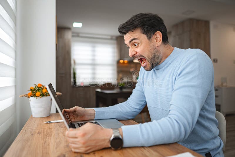 Man Sitting at Table with Laptop Stock Photo - Image of screen ...
