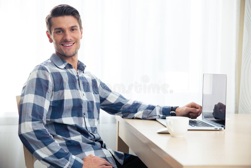 Man Sitting at the Table with Laptop Stock Photo - Image of business ...