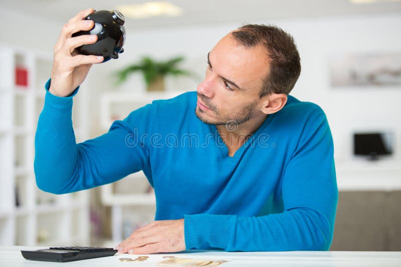 Man Sitting at Table with Piggy Bank Stock Image - Image of bank, save ...