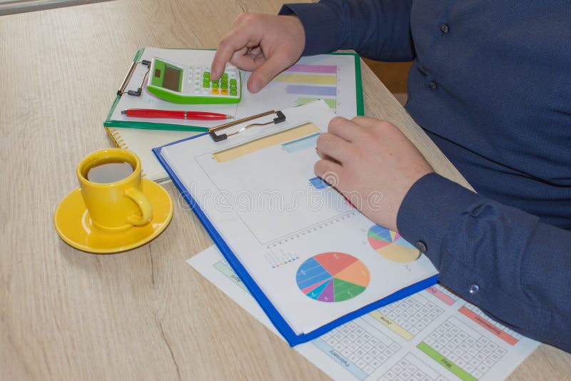 Man Sitting at the Table with Stretching in the Office. Businessman ...