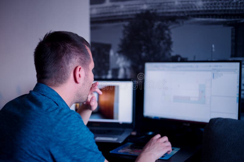 Man Sitting at the Table Using Computer for Business Stock Photo ...