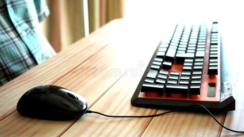 Man Sitting at a Table and Using His Computer Mouse Stock Footage ...