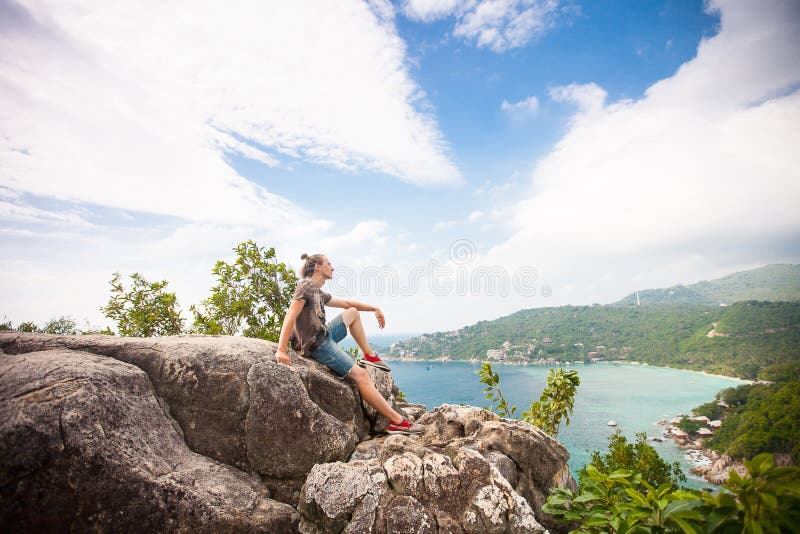 Man Sitting on Top of a Mountain and Enjoying View Stock Photo - Image ...
