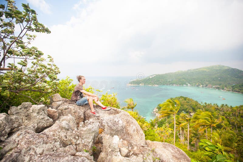 Man Sitting on Top of a Mountain and Enjoying View Stock Photo - Image ...