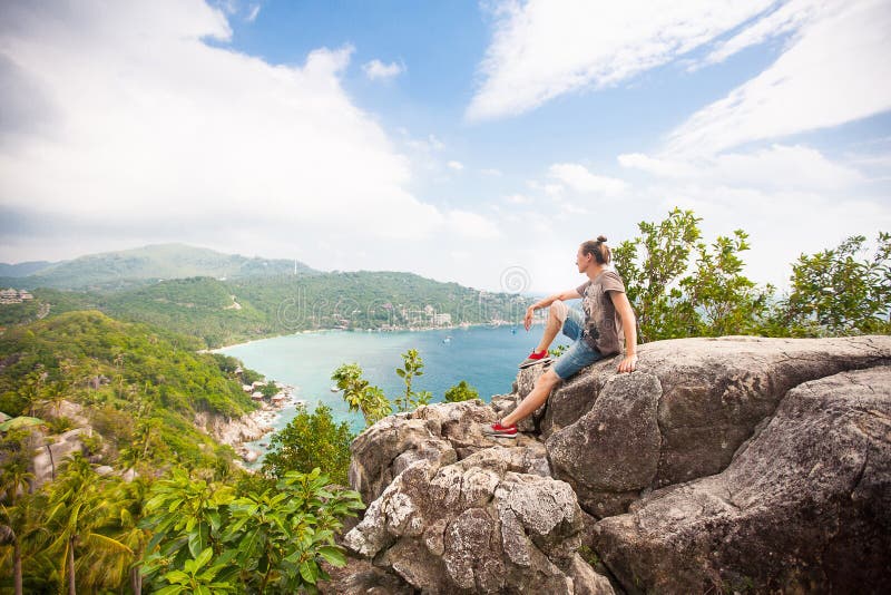 Man Sitting on Top of a Mountain and Enjoying View Stock Photo - Image ...