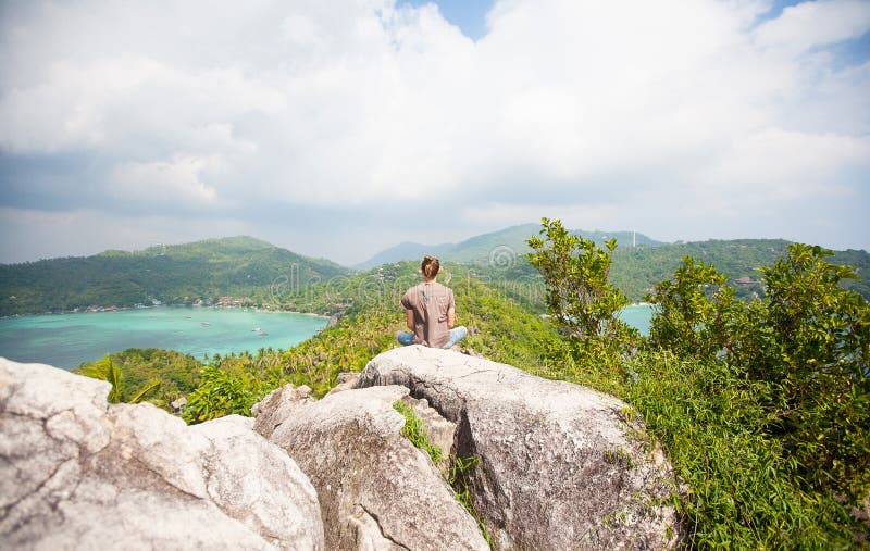Man Sitting on Top of a Mountain and Enjoying View Stock Photo - Image ...