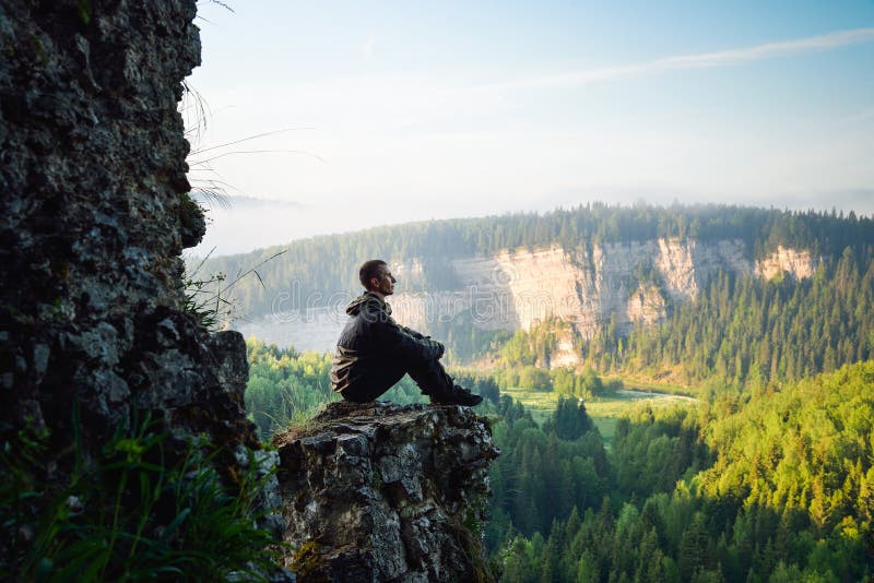 Man Sitting on the Top of the Mountain, Leisure in Harmony with Nature ...