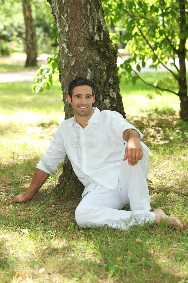 Man sitting under a tree stock image. Image of relax - 35937301