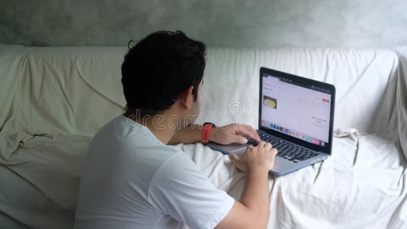 Man Sitting Use Laptop Computer on Sofa in Living Room Stock Footage ...