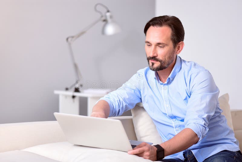 Man Sitting and Using Laptop Stock Photo - Image of capacity ...
