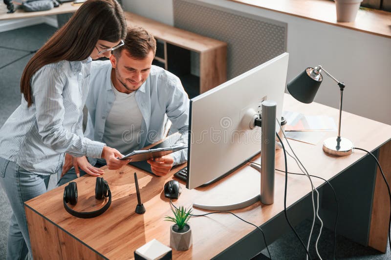 Man is Sitting, Woman is Standing. Using Pc Stock Photo - Image of ...