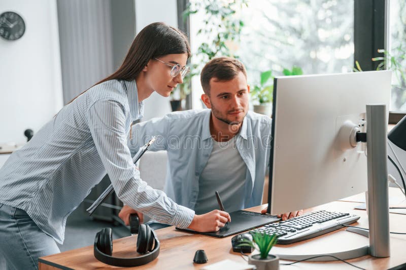 Man is Sitting, Woman is Standing. Using Pc Stock Image - Image of hair ...