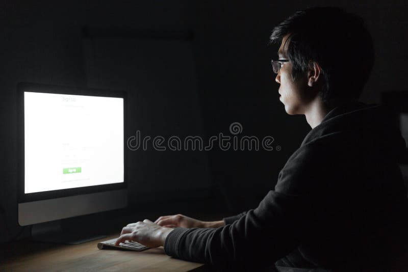 Man Sitting and Working with Computer in Dark Office Stock Photo ...