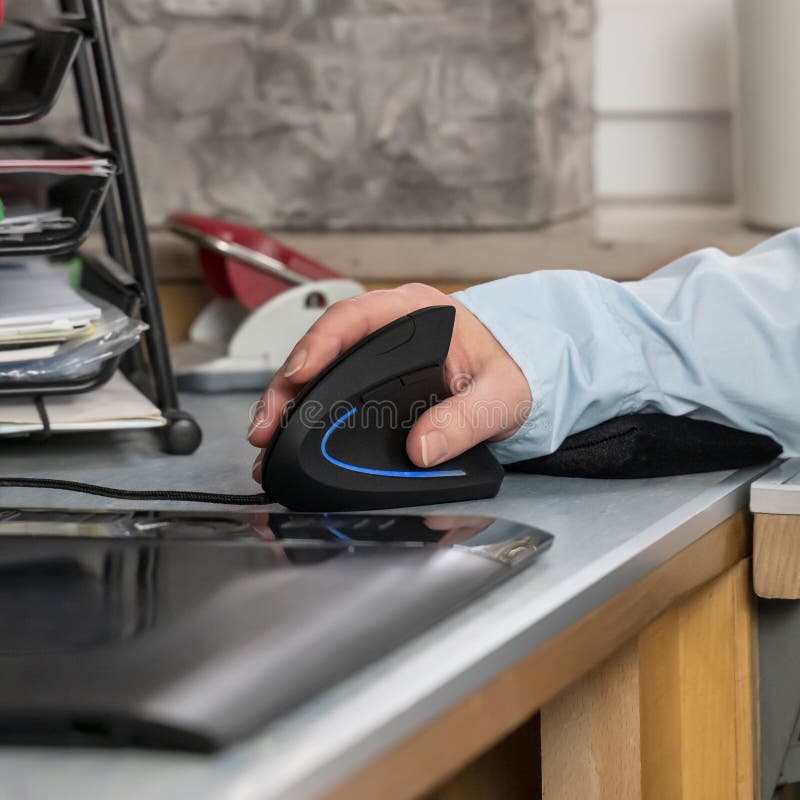 Man Sitting at a Workspace Desk, Holding a Computer Mouse Stock Image ...