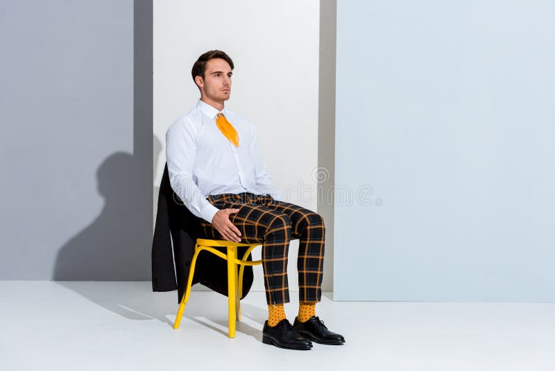 Man Sitting on Yellow Chair on Stock Photo - Image of fashion, style ...
