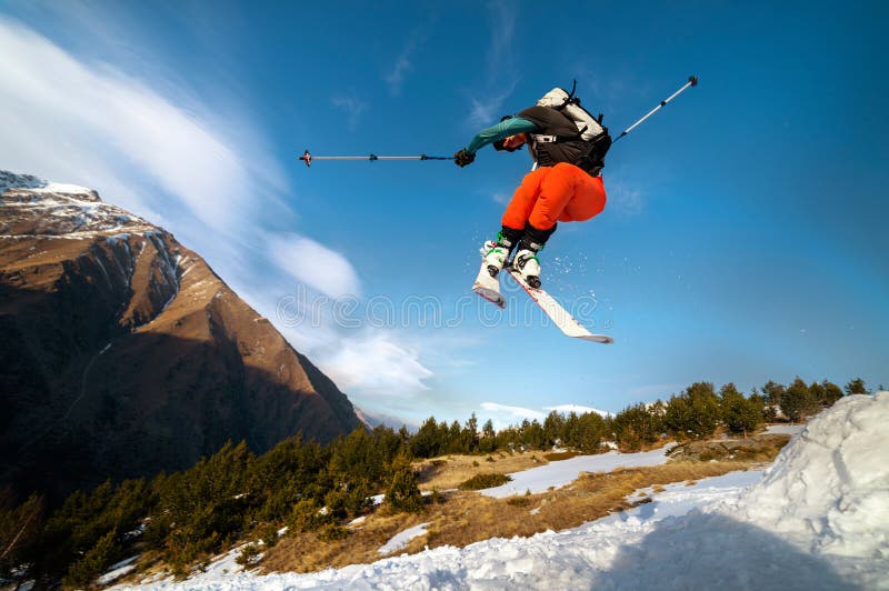 Man Skier in Flight after Jumping from a Kicker in the Spring Against ...