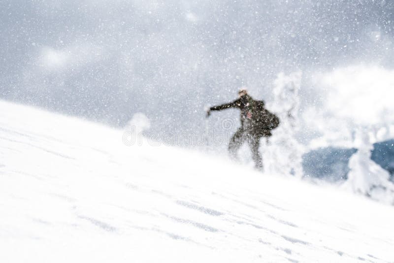 Man Skier Goes Up on Powder Snow in the Mountains in a Snowfall. Stock ...