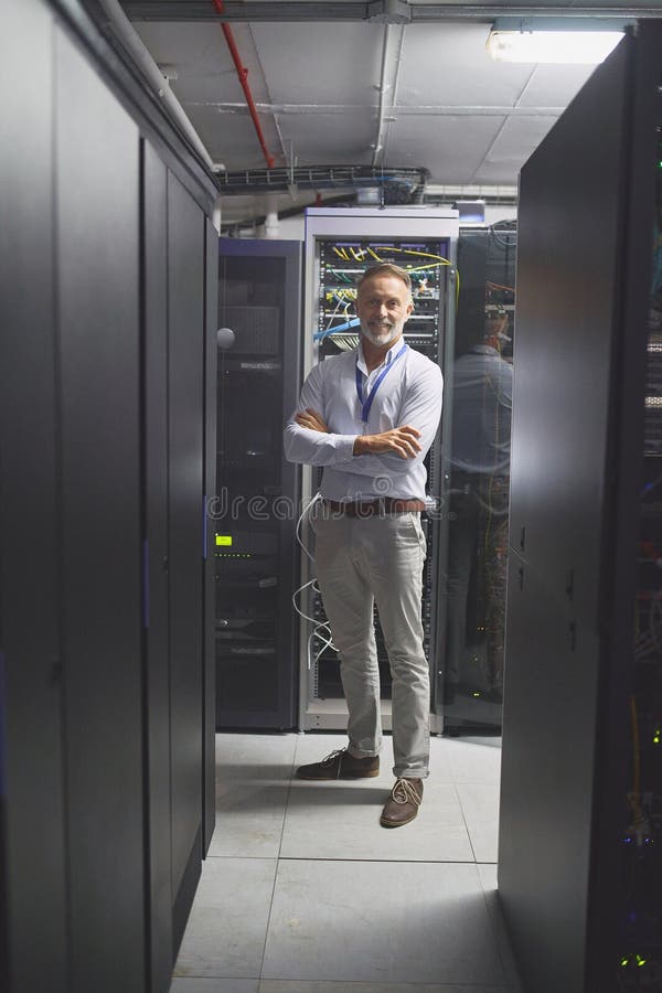 The Man Skilled in Multiple Systems. Portrait of a Mature Man Working ... The Man Skilled in Multiple Systems. Portrait of a Mature Man Working ...