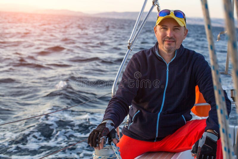 Man the Skipper on His Yacht. Stock Image - Image of sailor, sail: 78268643