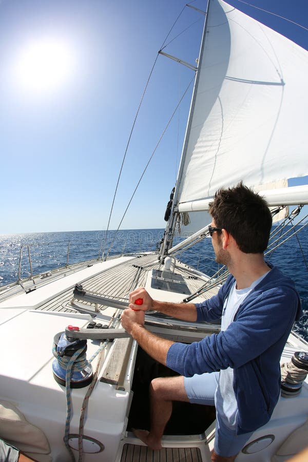 Man Skipper Navigating Sailing Boat Stock Image - Image of holidays ...