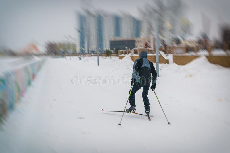 A man skis along the river stock image. Image of alpinist - 106140363