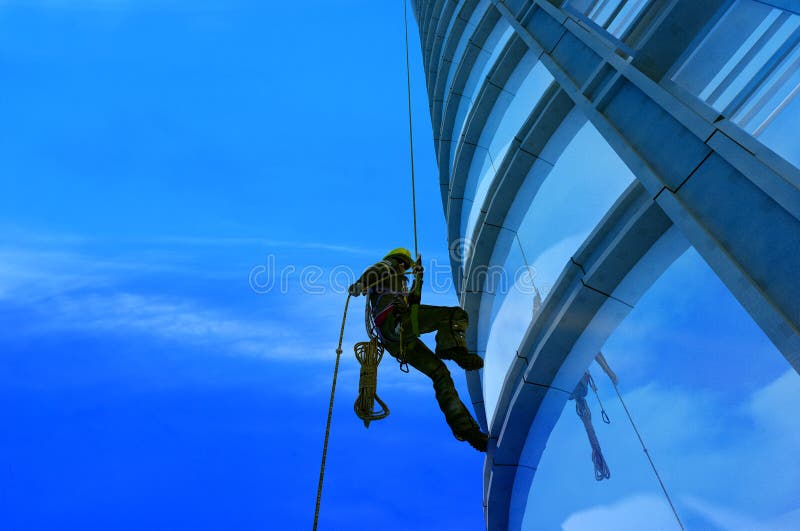 Man on a skyscraper stock illustration. Illustration of reflection ...
