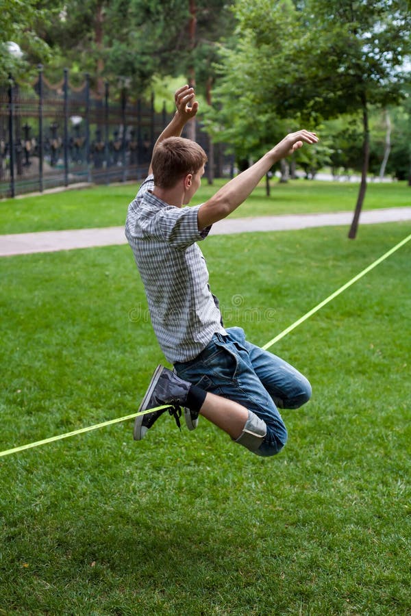 Man in the slackline stock image. Image of gymnastics - 32840475