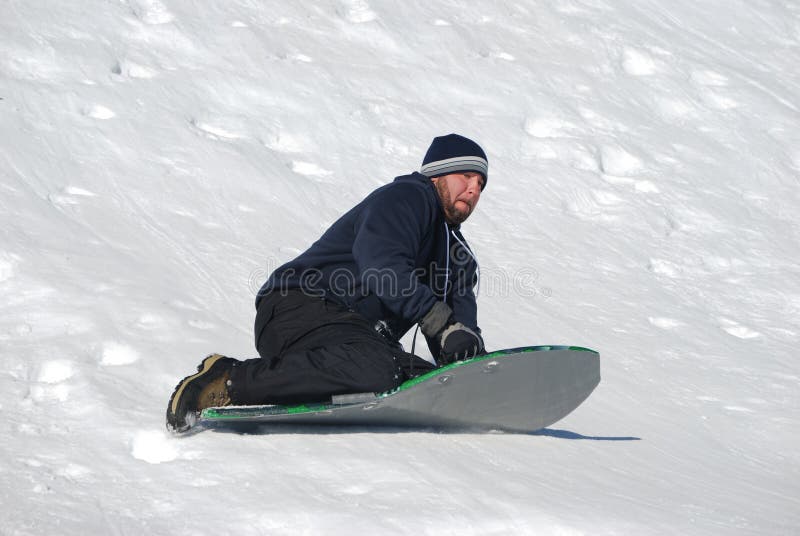 Man Sledding Down Snowhill Stock Photos - Free & Royalty-Free Stock ...