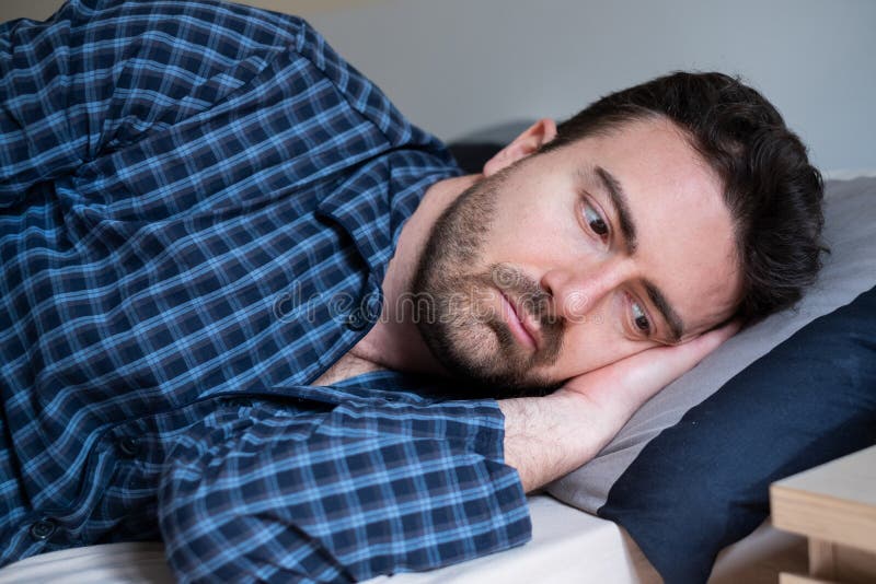 Man with Sleep Disorder Lying in the Bed Stock Image - Image of ...