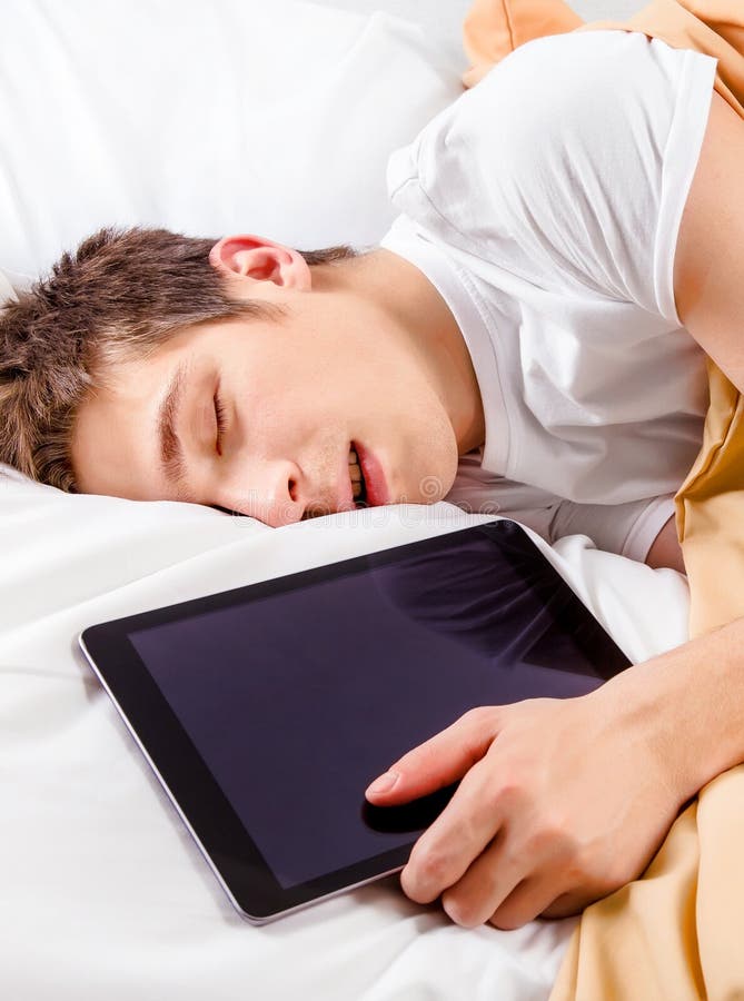Man sleep with a Tablet stock image. Image of pillow - 234394455