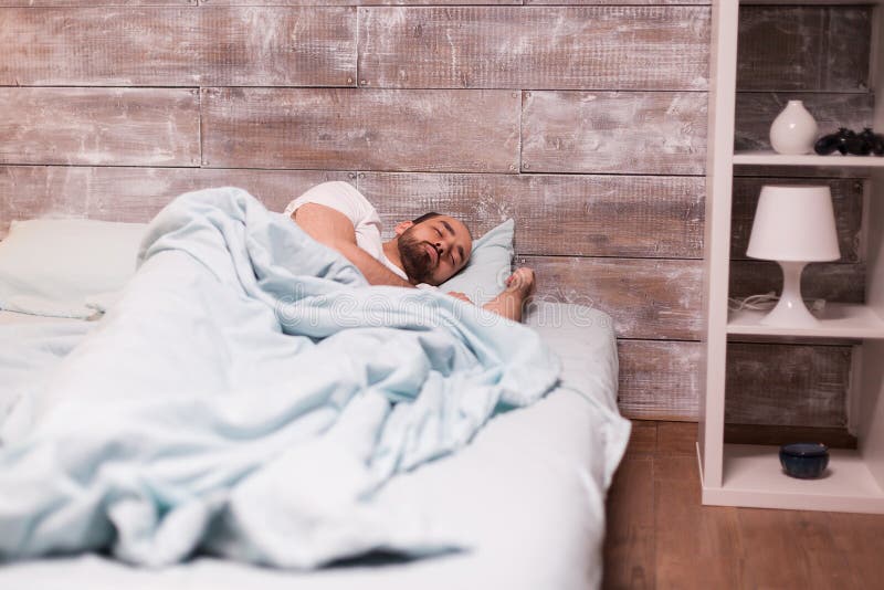 Man Sleeping Alone in His Comfortable Bed Stock Image - Image of alone ...