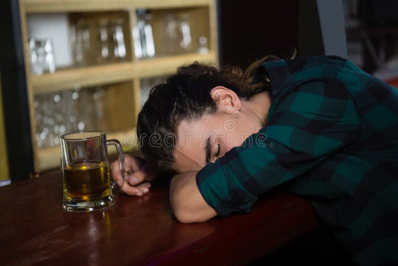 Man Sleeping on Bar Counter Stock Image - Image of industry, alcoholism ...