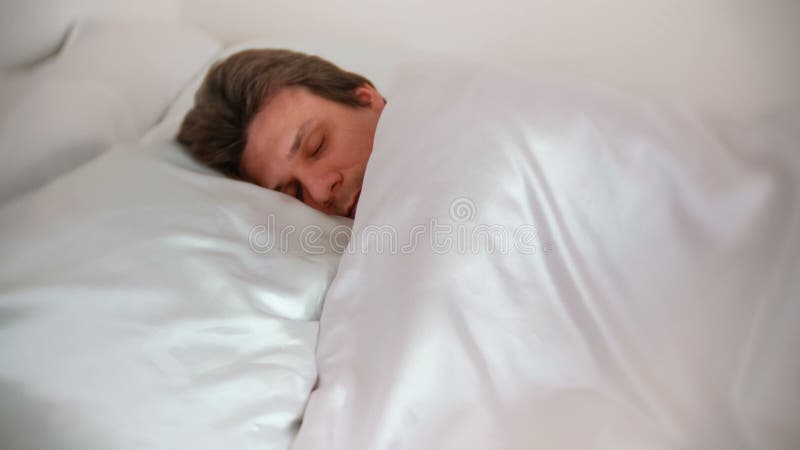 Man is Sleeping in Bed Alone Under the Blanket. Side View. Stock ...