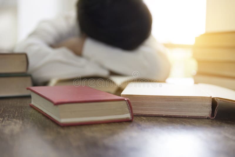 Man Sleeping on Book with Textbook Stack on Wooden Desk Stock Image ...