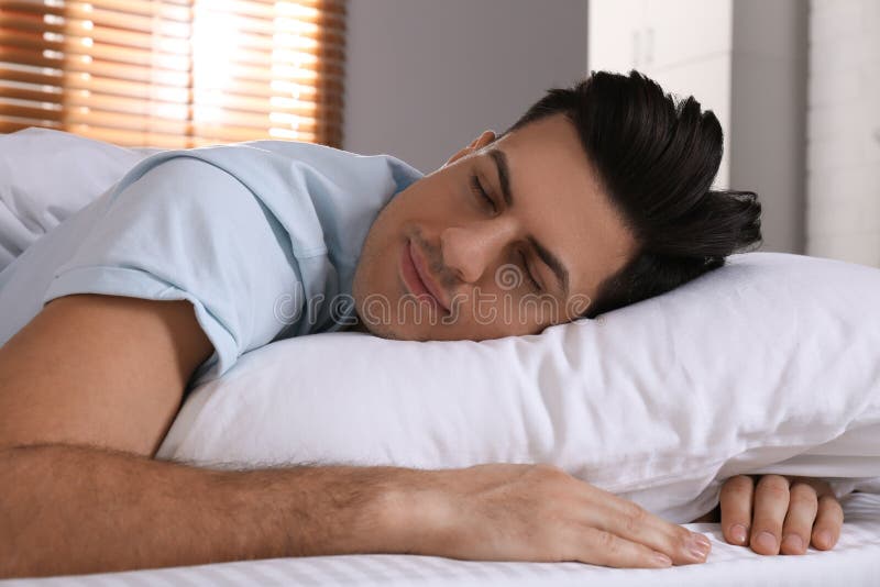 Man Sleeping in Comfortable Bed with White Linens Stock Image - Image ...