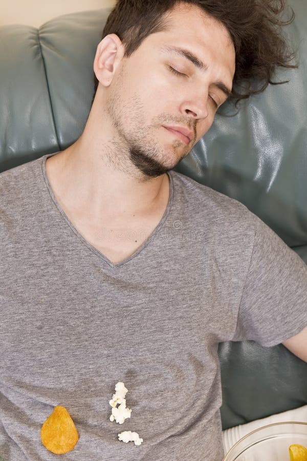 Sleeping Young Man Relax after Work, Beer and Popcorn and Chips Stock ...