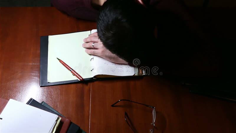 Man Sleeping on His Notes stock footage. Video of video - 65060346