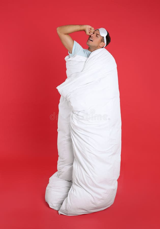 Man in Sleeping Mask Wrapped with Blanket on Red Background Stock Image ...