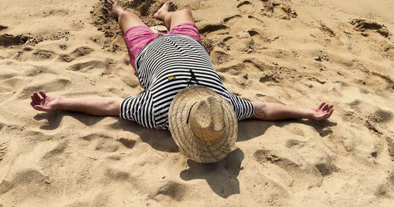 Man Sleeping on the Ocean Shore. Man Sleeping on the Beach on the Ocean ...