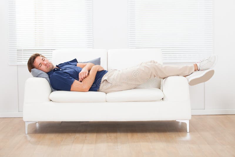 Man Sleeping on Sofa at Home Stock Photo - Image of horizontal, adult ... Man Sleeping on Sofa at Home Stock Photo - Image of horizontal, adult ...