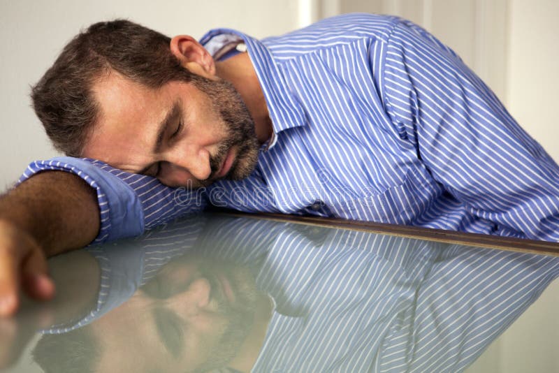Man sleeping at table stock image. Image of resting, exhausted - 58708061