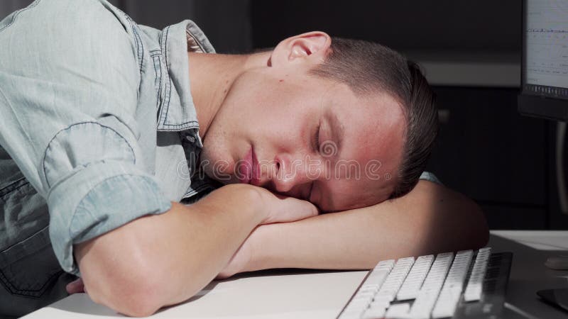 Man Sleeping on the Table in Front of the Computer Stock Photo - Image ...